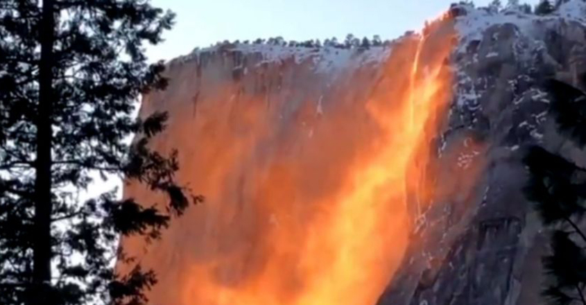 'Flaming' waterfall at the top of the hill; Behind the miraculous ...